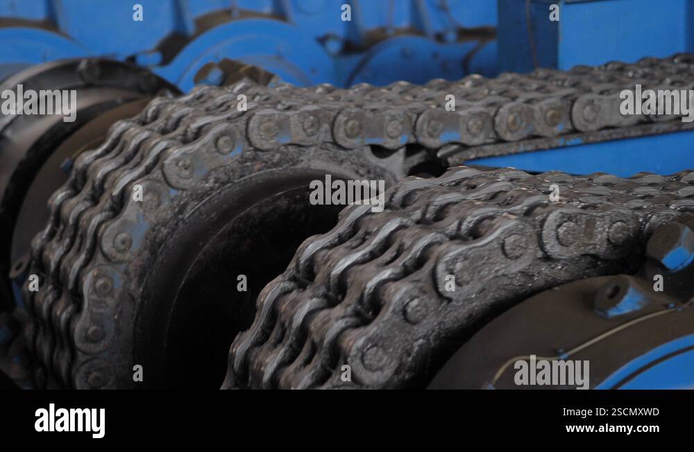 Powerful gears with a chain Stock Video Footage - Alamy