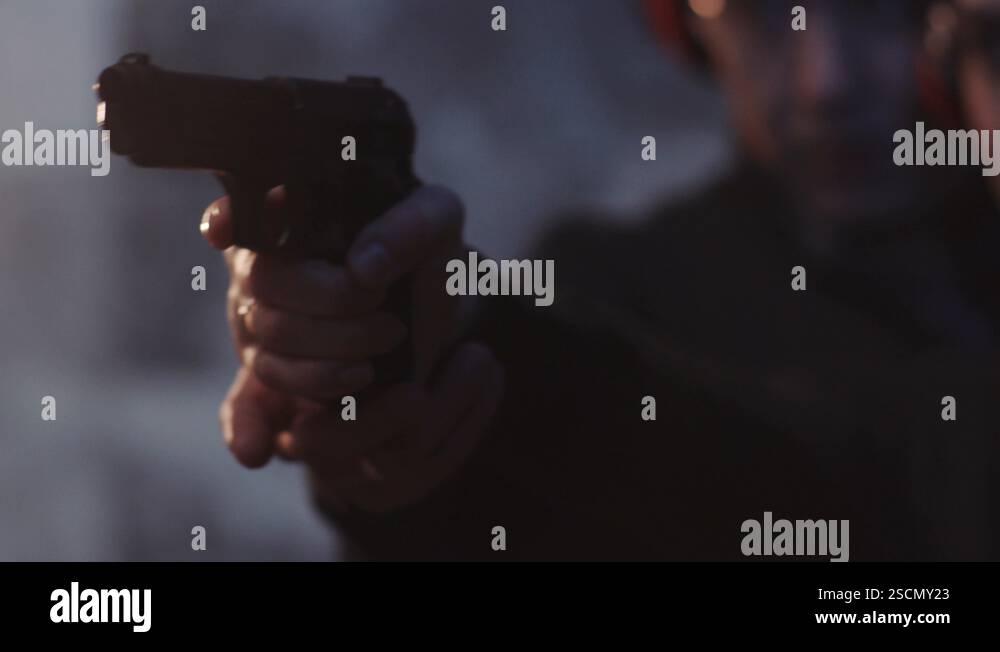 Hands man teaches a woman how to shoot a gun indoors pistol speed ...