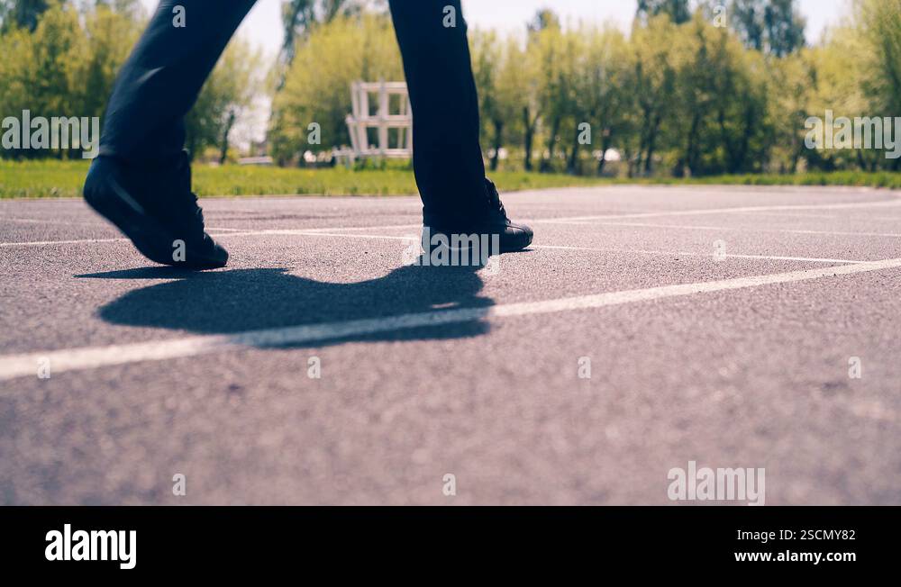 CU, Back shot: Young cute girl, sporty physique, at the stadium. She ...