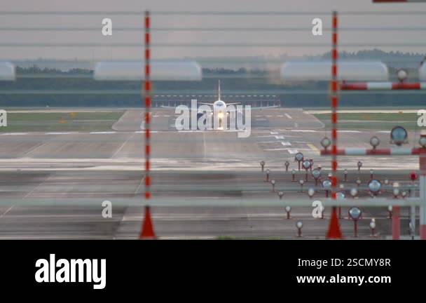 Aircraft acceleration for takeoff, view from the end of the runway ...