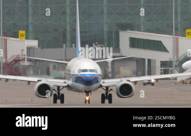 Passenger airplane with an unrecognizable livery is taxiing to the ...