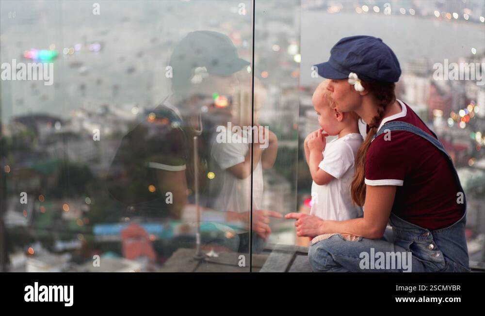 Mother is telling something hugging her baby Stock Video Footage - Alamy