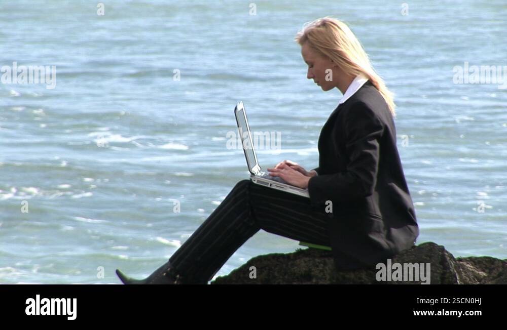 Busineswoman working on computer outside Stock Video Footage - Alamy