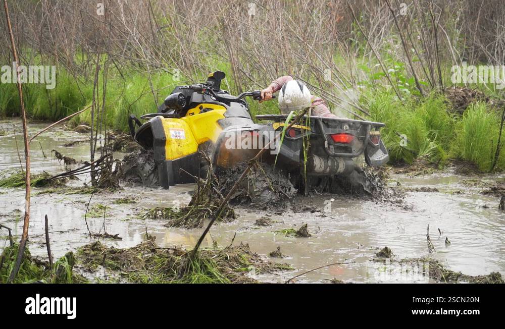 Drive ATV through swamp, water, mud and mud. slow motion Stock Video ...