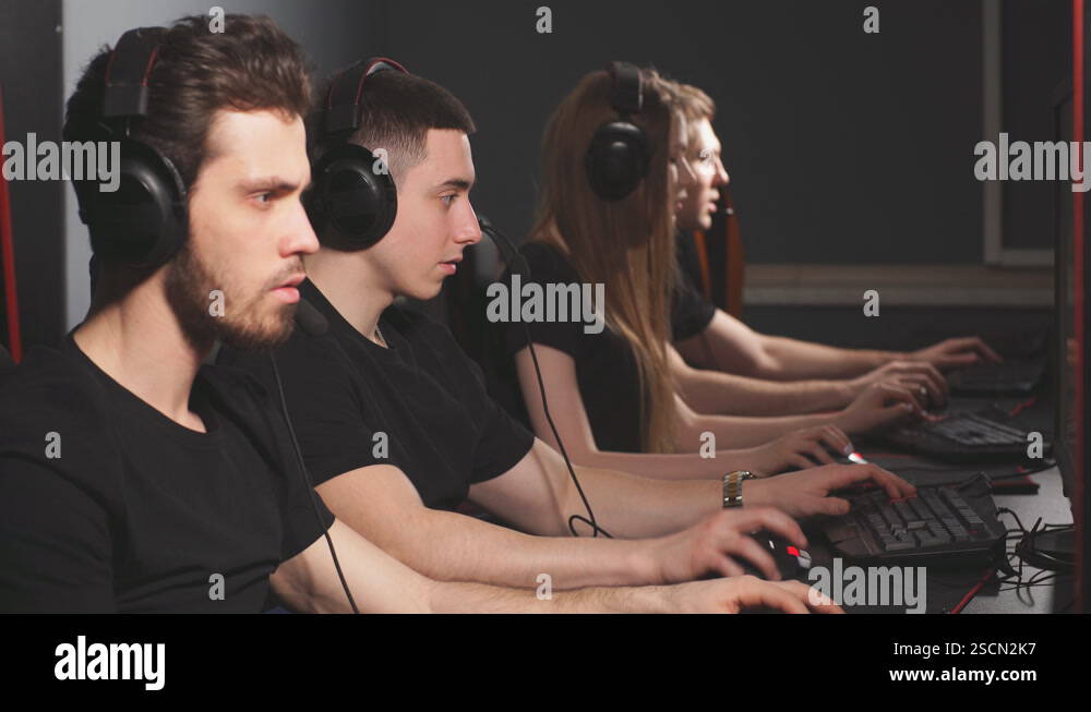 Team of eSport diverse gamers playing video games on a cyber game ...