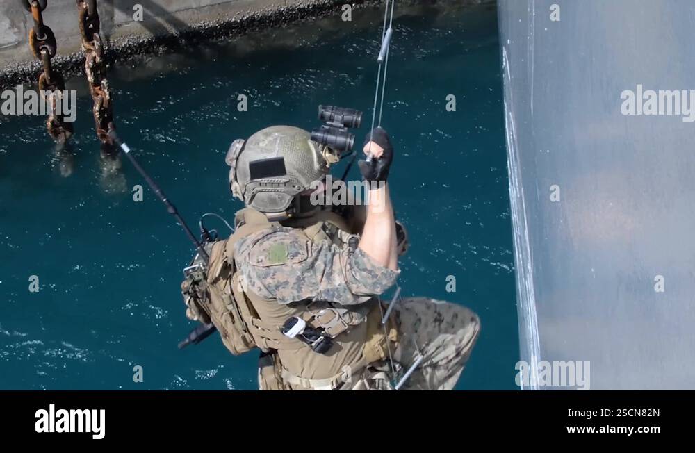Soldier boards a ship using a tactical ladder Stock Video Footage - Alamy