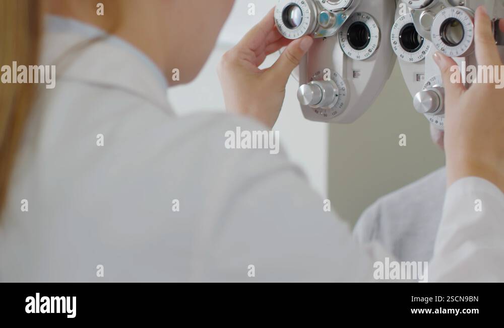 Optometrist Conducting Eye Exam with Phoropter Stock Video Footage - Alamy