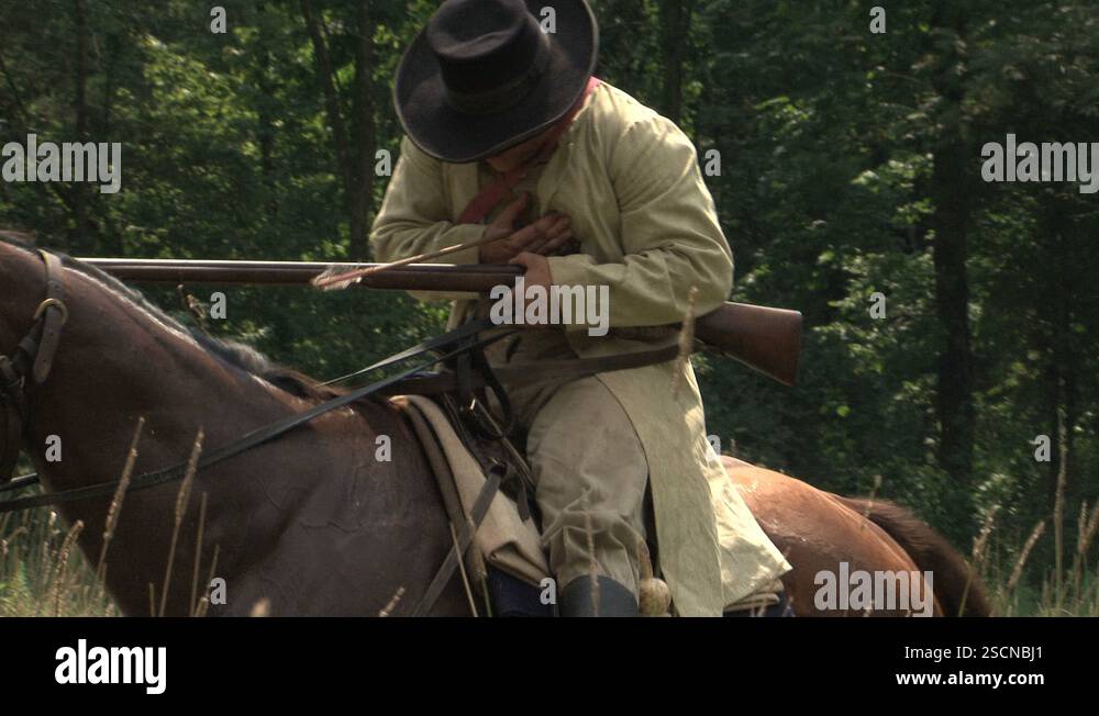 1800s era Western Texas Marshall / Ranger rides on Horseback. Shot with ...