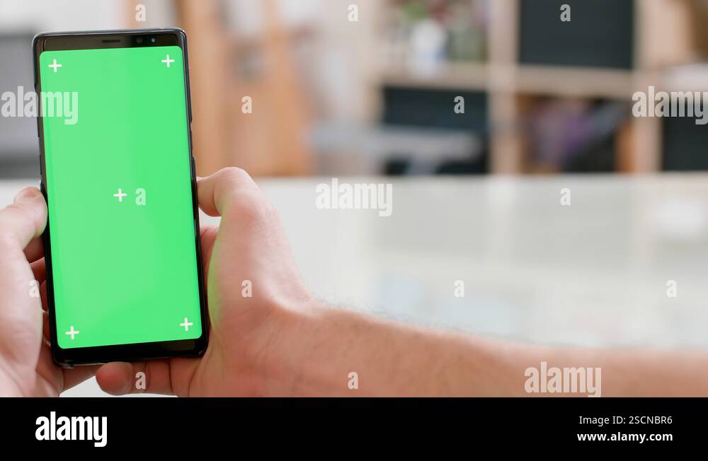 Smooth slide motion with a green screen on a smartphone display Stock ...