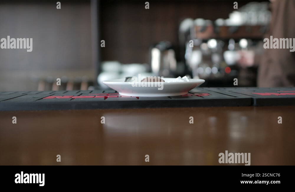 Barista made coffee and serves it to the bar. Background cup of coffee ...