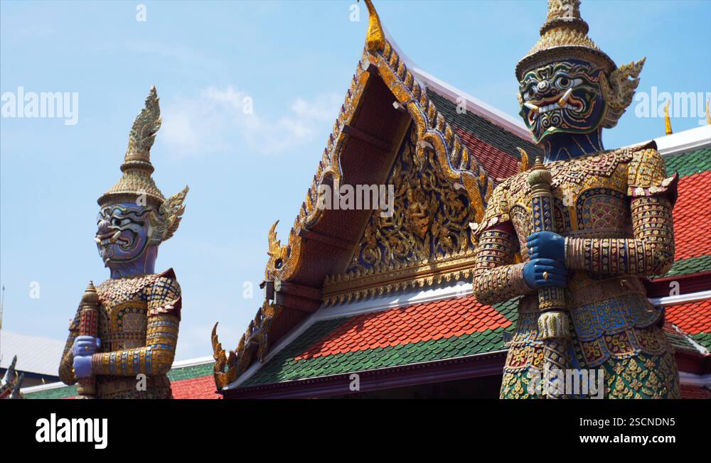 Giant demon guards statues in the Temple of the Emerald Buddha ...