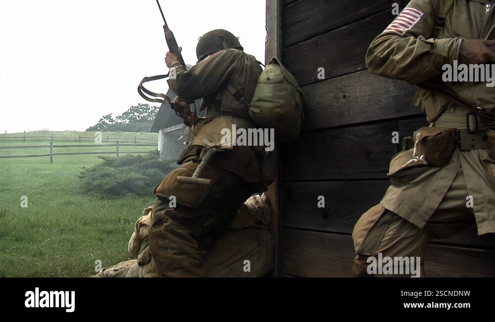WW2 U.S. Army Airborne charge a French village with an M1911 Pistol Stock Video Footage - Alamy