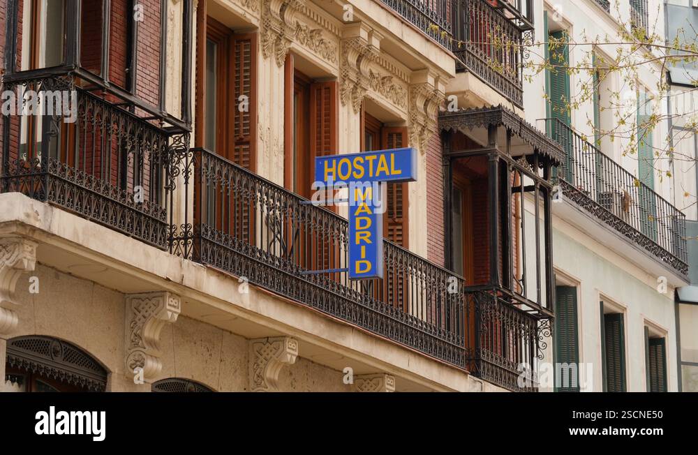 Madrid hotel and hostel signboards on building facades for travelers to ...