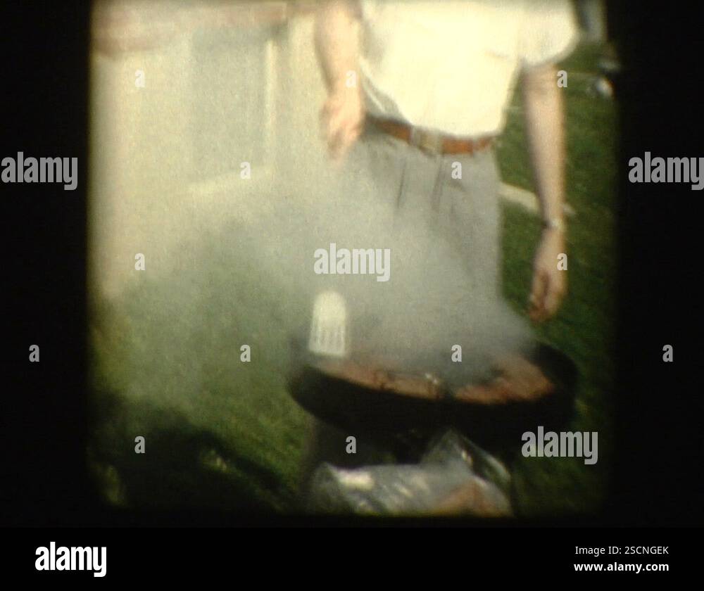 50s man grilling burgers smokey Barbque Stock Video Footage - Alamy