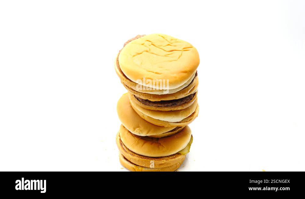 Tall stack of beef burgers on flat hamburger buns Stock Video Footage ...