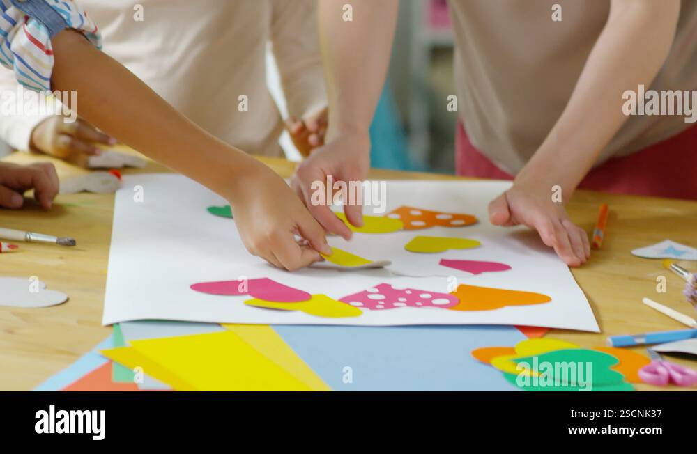 Little Diverse Kids Making Paper Craft with Female Teacher Stock Video ...