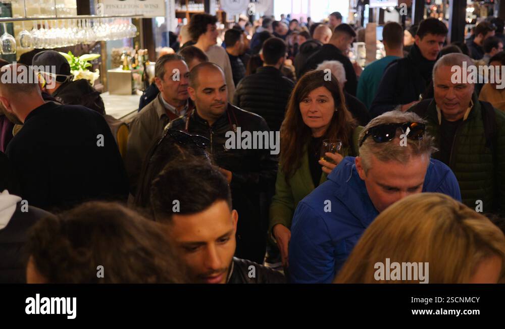 MADRID SPAIN People visit buy and eat various delicacies and tasty food ...