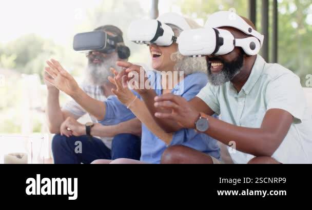 Using VR headsets, senior friends enjoying virtual reality gaming ...