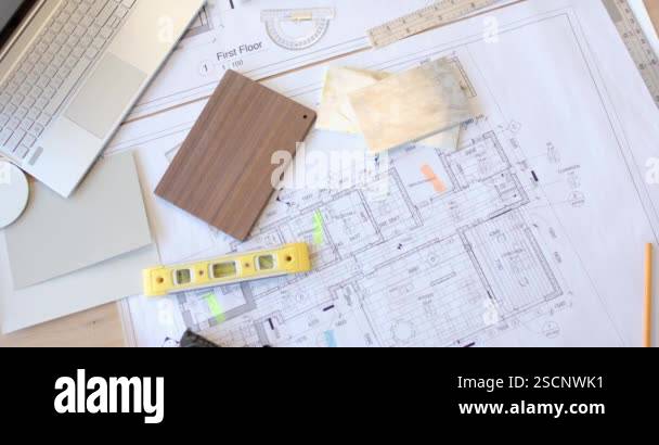 Planning construction, architectural blueprints with level, ruler, and ...