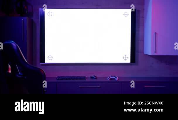 Gaming setup with large screen, keyboard, mouse, and controller in ...