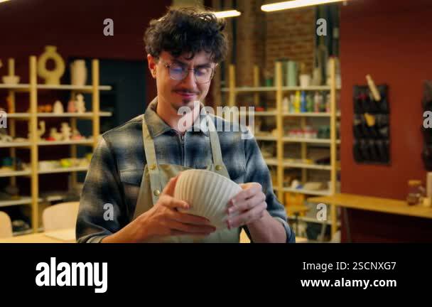 Male potter artist sculptor work with clay art workshop Caucasian ...