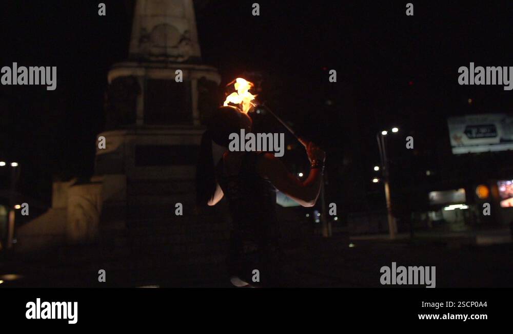 woman spiting fire in a fire show at night - slow motion Stock Video ...