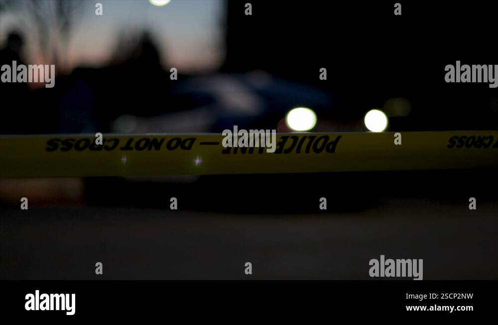 Police car at night with yellow crime scene tape. Blocking off the ...