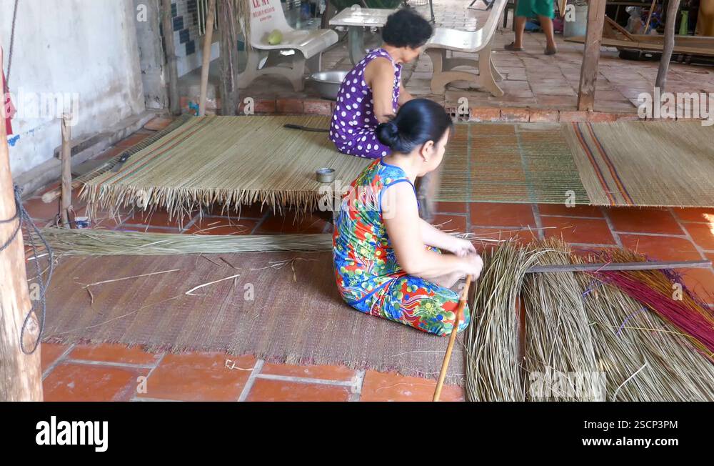 Women making traditional reed mats Stock Video Footage - Alamy