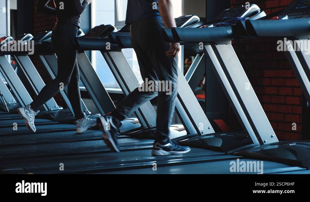In the frame of male and female legs on a treadmill Stock Video Footage ...