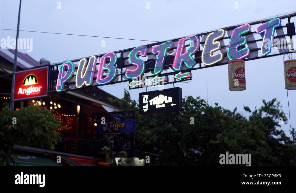 Illuminated letters "Pub street" above Pub street in evening. Siem Reap ...