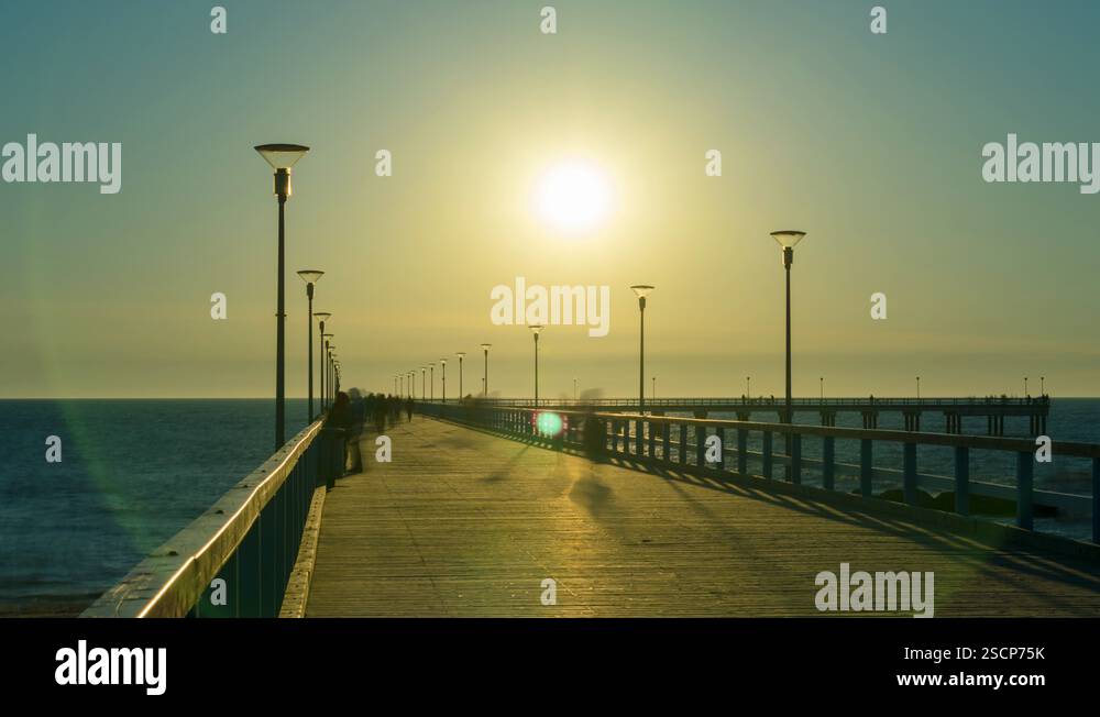 Sunset on the pier in Palanga, Lithuania, time-lapse Stock Video ...