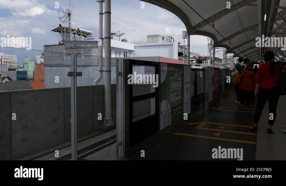 Jakarta MRT - Commuter Arrive at Station - Passenger Step In Stock ...