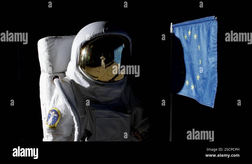 Shaky, CU, ZO, ZI of an astronaut putting up a European Union flag on ...