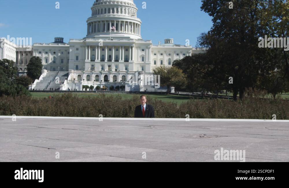 SLO MO, MS of a well-dressed man running from the US Capitol Building ...
