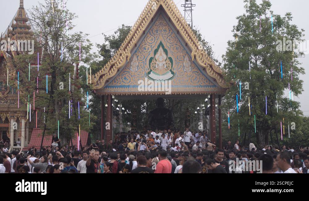 Buddhist monks spray water on the crowd Stock Video Footage - Alamy