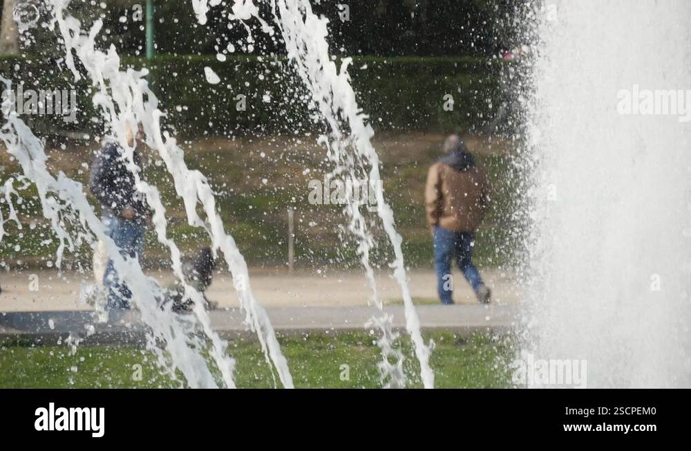 Cheerful stream of sparkling water in a fountain in Brussels in spring ...