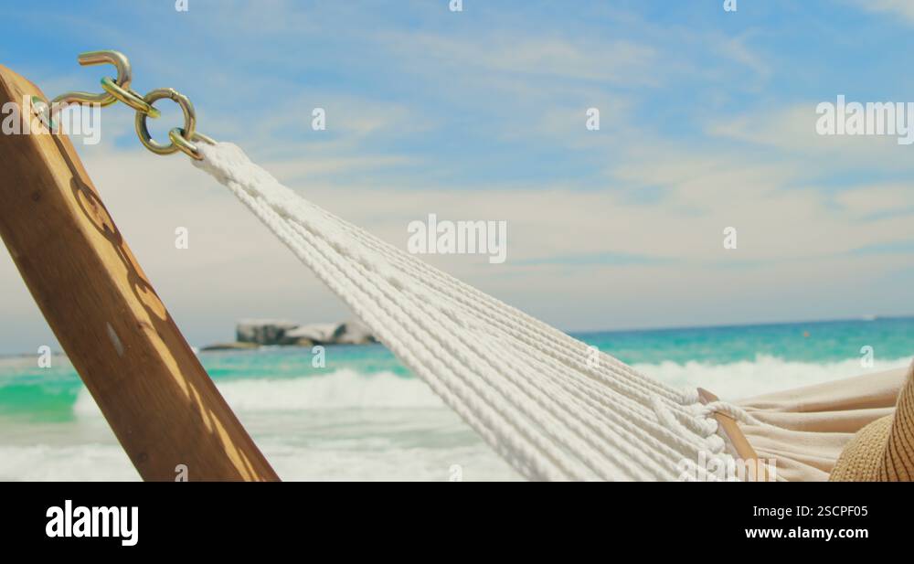 Side view of Caucasian woman relaxing in a hammock at beach 4k Stock ...