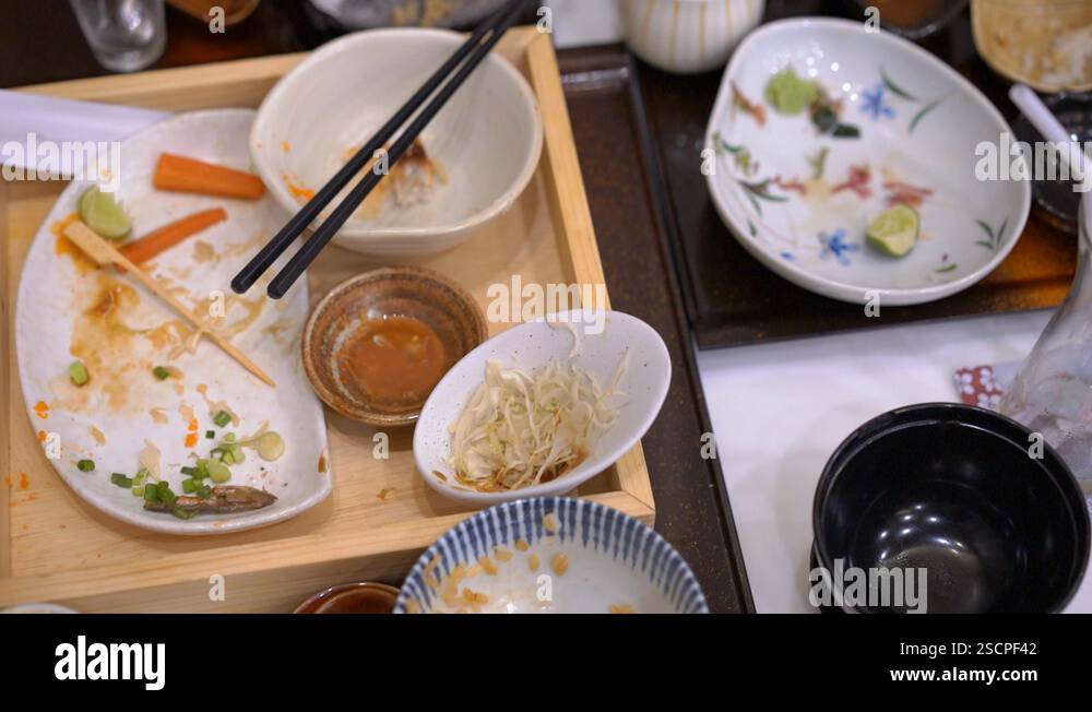 Empty plates and cups after meal in a japanese restaurant. concept of a ...
