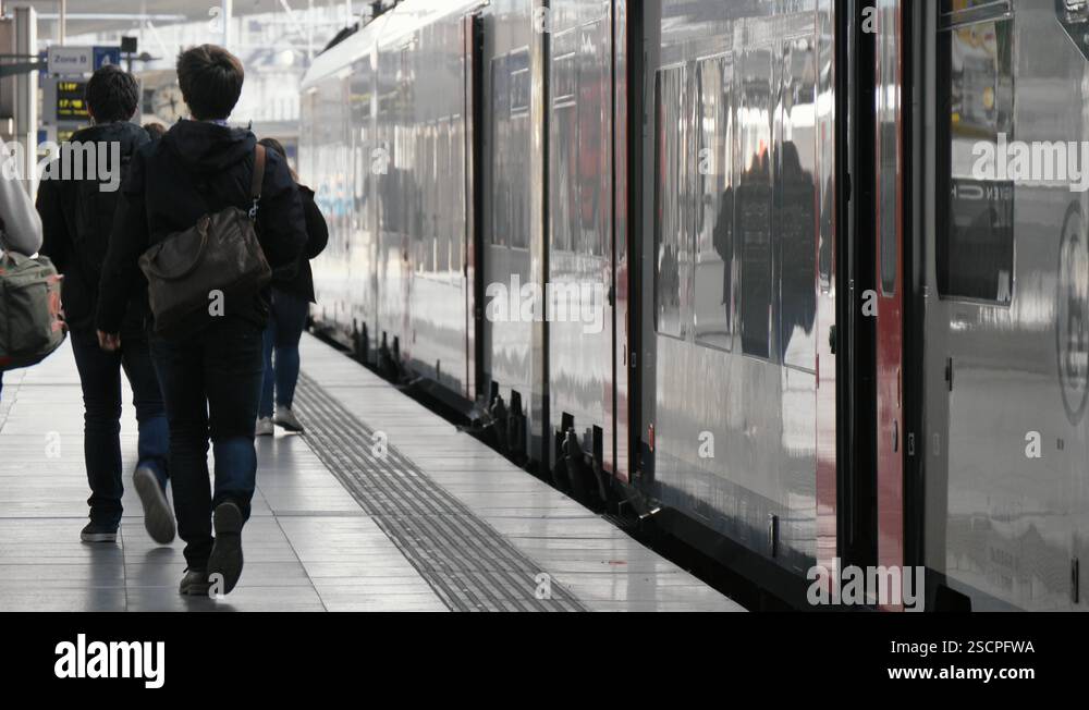 Passengers going and entering the modern train at Antwerp station in ...
