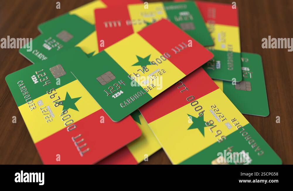 Pile of credit cards with flag of Senegal. Senegalese banking system ...