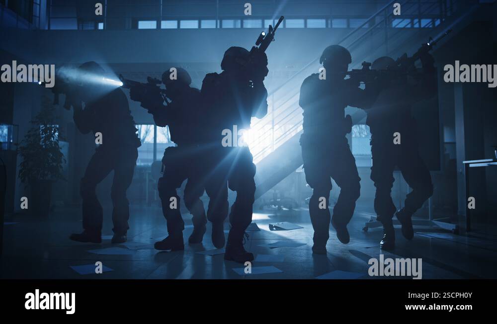 Masked Fireteam of Armed SWAT Police Officers Storm a Dark Seized ...