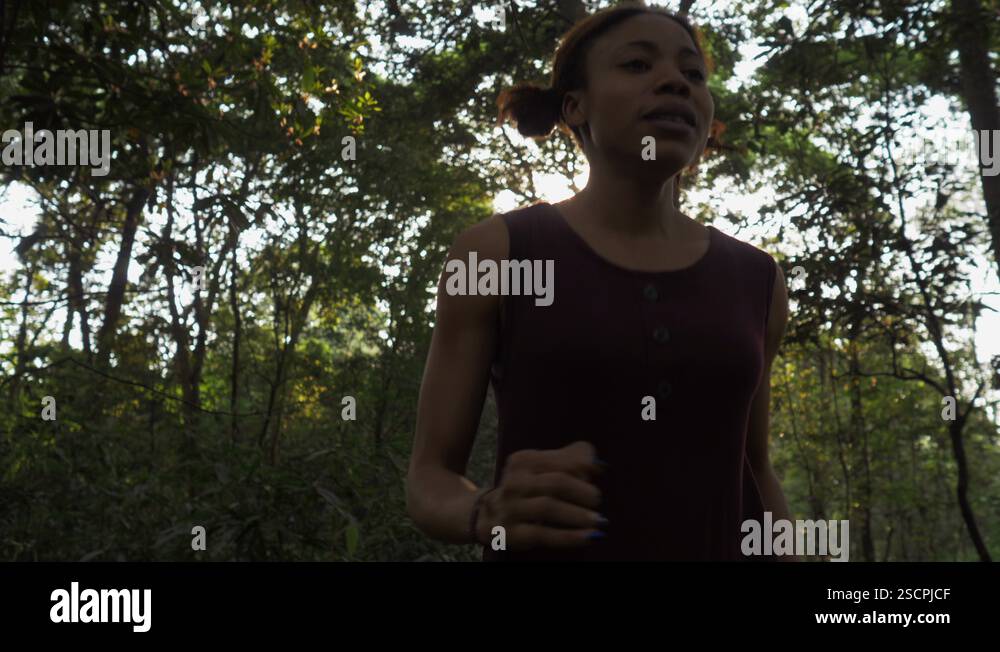 Lost woman running in the woods Stock Video Footage - Alamy