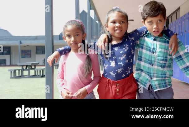 In school, group of children walking together and smiling during recess ...