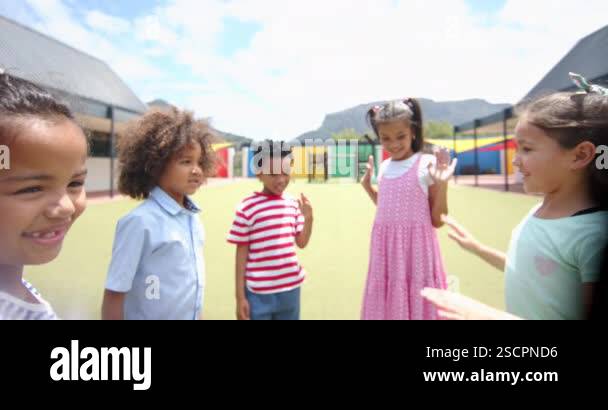 Playing together outside, group of school children enjoying recess activities. playground ...