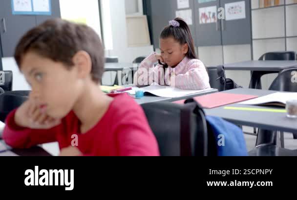 In school, children are focusing on their work in the classroom. One ...