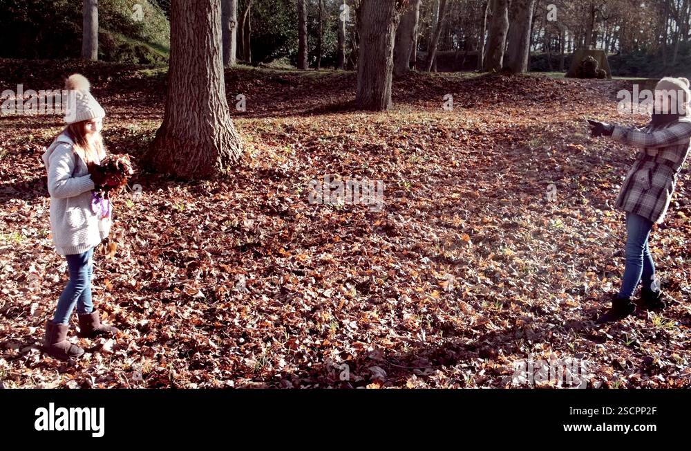 Mother and daughter get in leaf fight and throw leaves at eachother ...