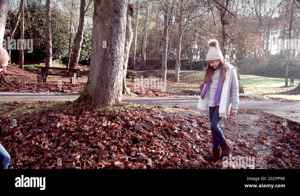 Mother and daughter get in leaf fight and throw leaves at eachother ...