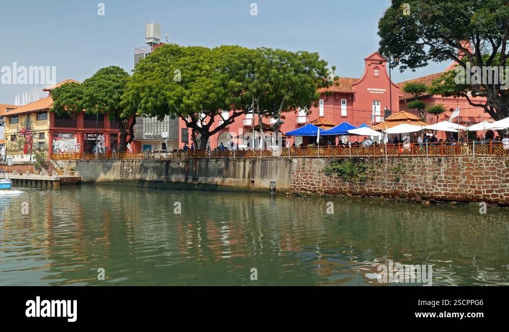 Riverside scenery of a cruise full of passengers crossing by the ...