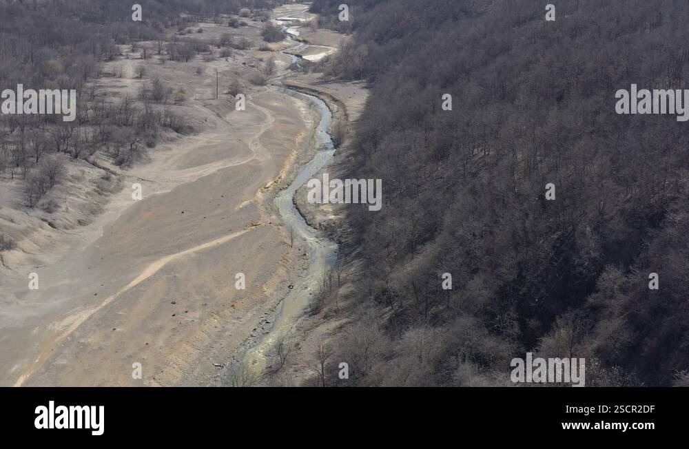 Mining drainage waste on polluted river coast 4K aerial video Stock ...