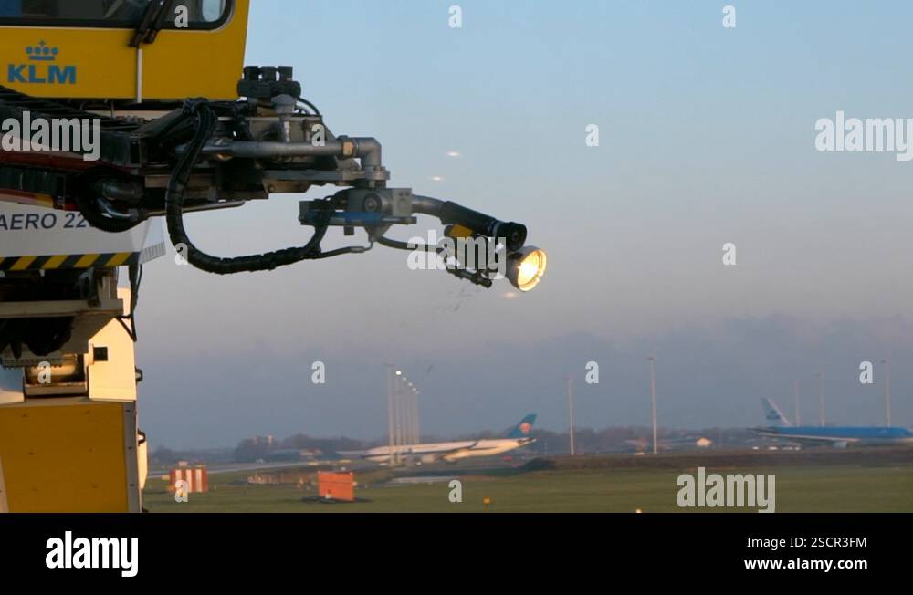 Slow Motion of spraying de-icer on aircraft wings. Plane ready for ...